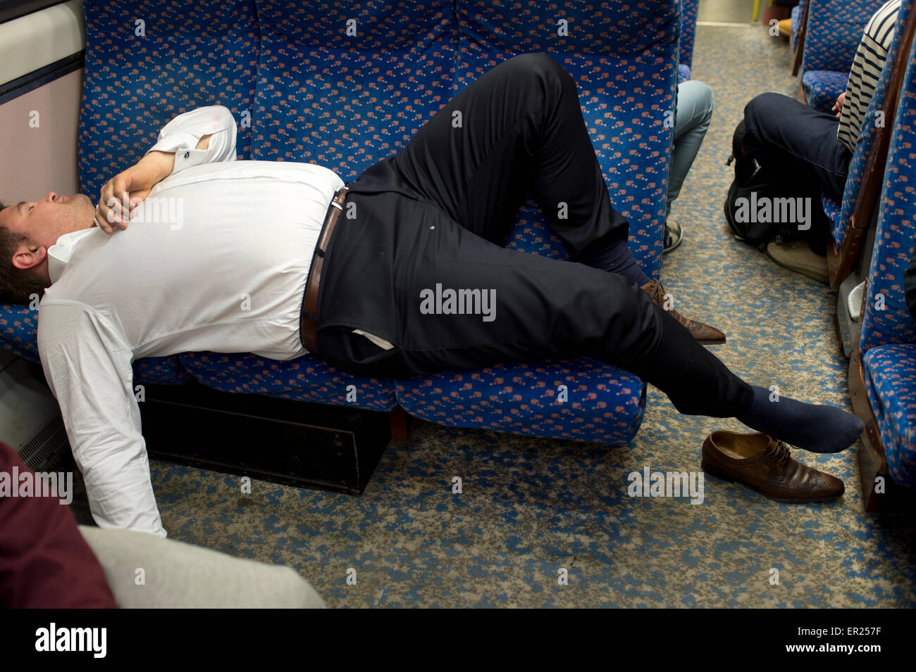 Liverpool Street. Commuter asleep on the train Stock Photo - Alamy