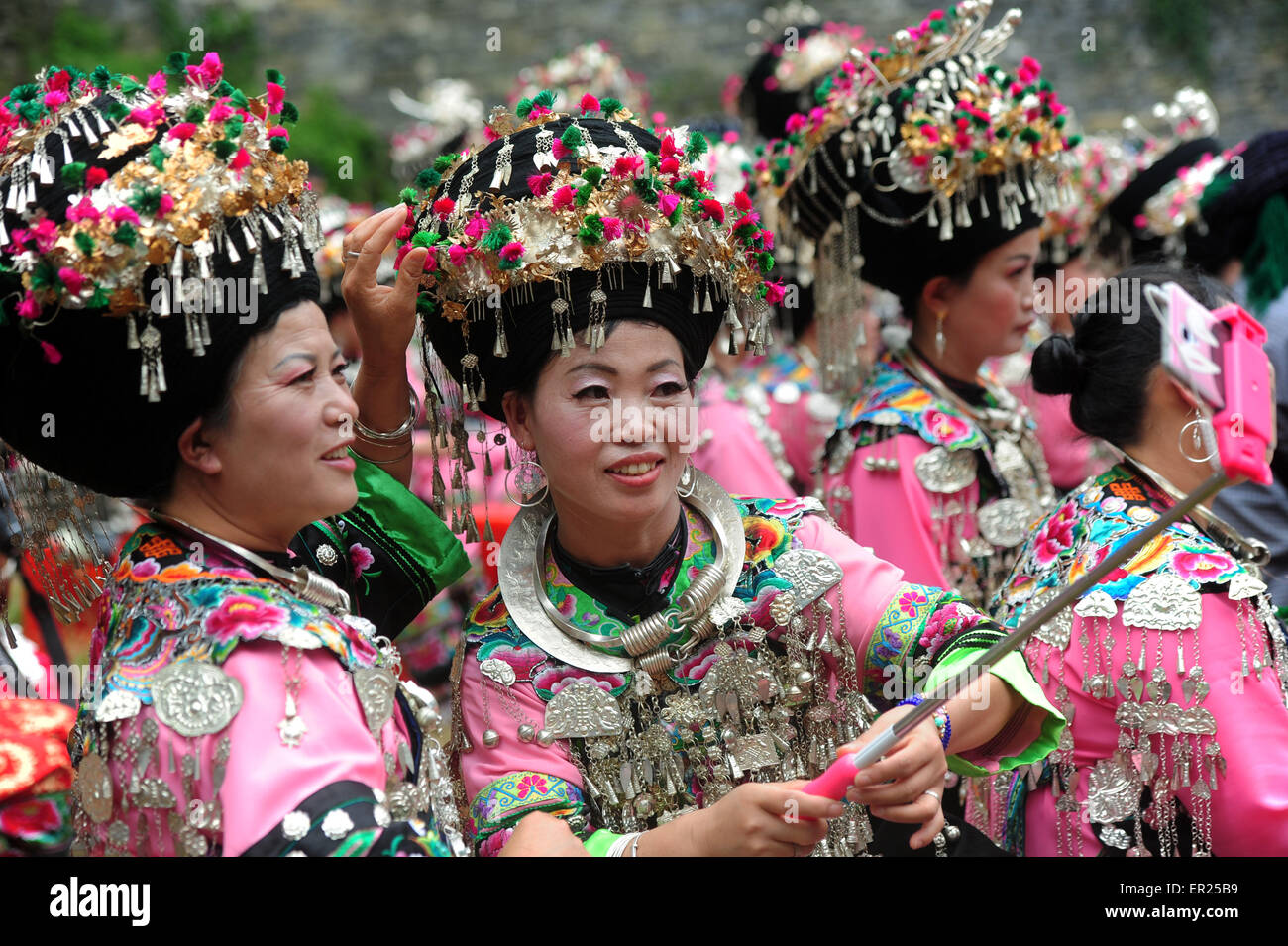 Fenghuang, China. 25th May, 2015. People attend the he 2015 Miao Girl Festival in Fenghuang ...