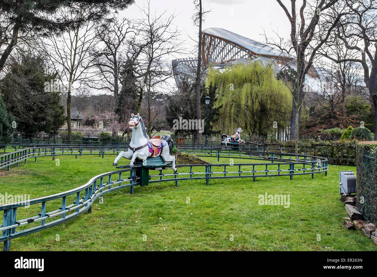 Traditional funfair horse race ride at Jardin d'Acclimatation children ...