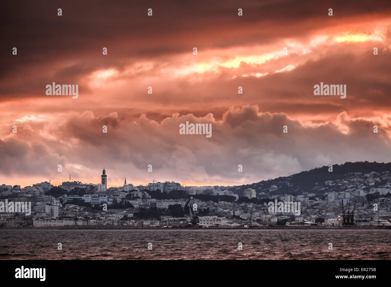 Bright red sunset sky over Tangier city, Morocco. High contrast red ...