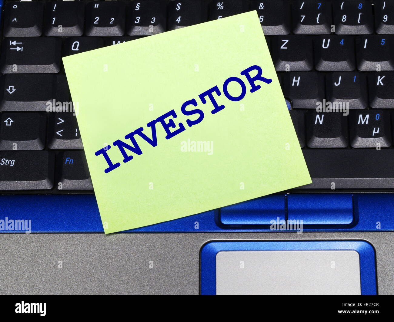 Memo note on notebook, investor Stock Photo - Alamy