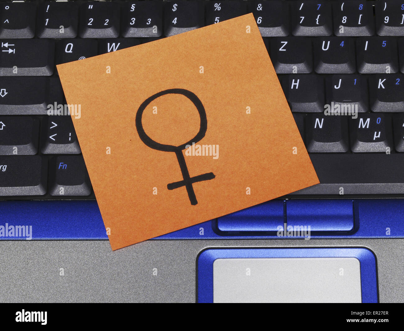 Memo note on notebook, symbol female Stock Photo - Alamy
