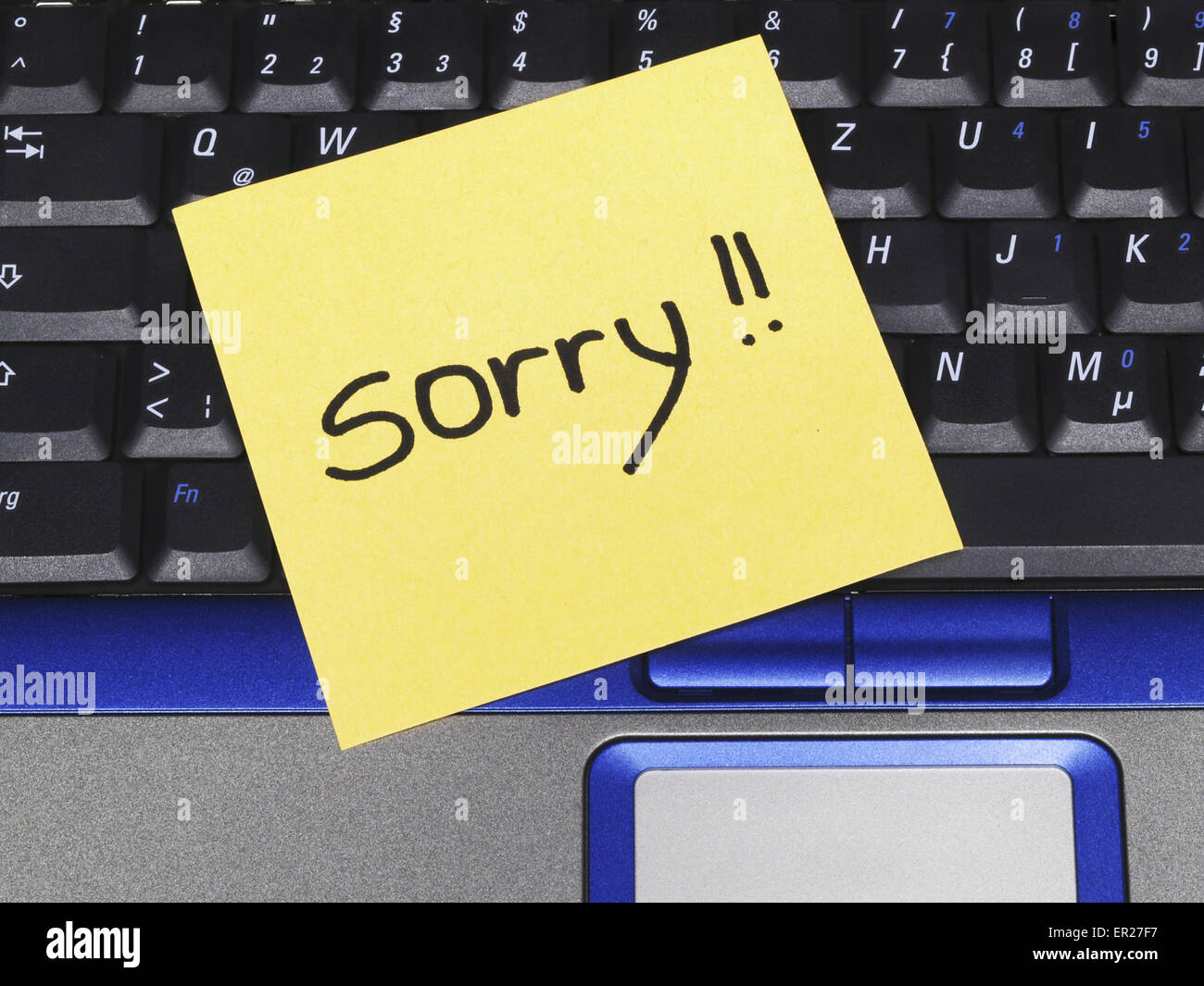 Memo note on notebook, sorry Stock Photo - Alamy