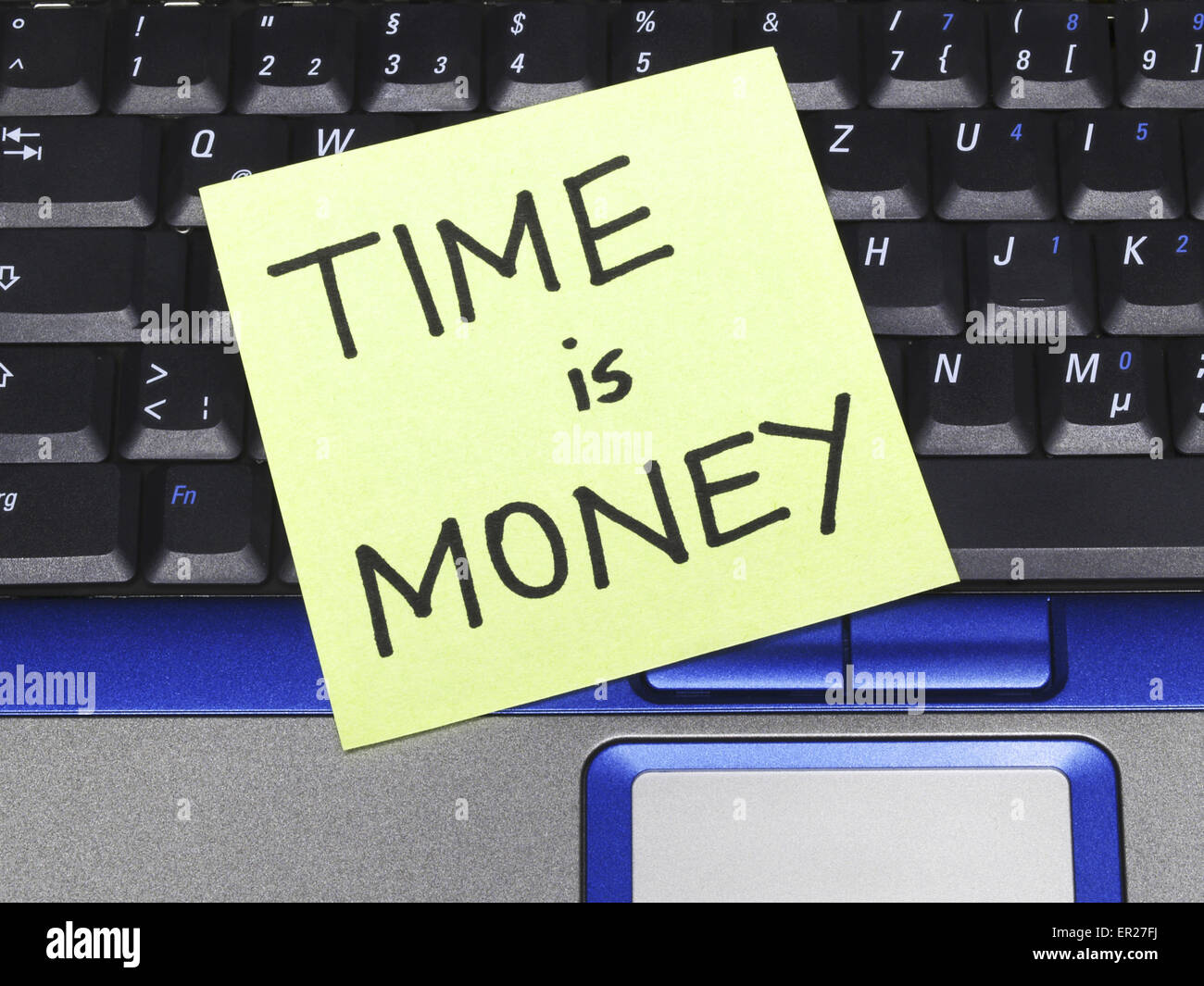 Memo note on notebook, time ist money Stock Photo - Alamy
