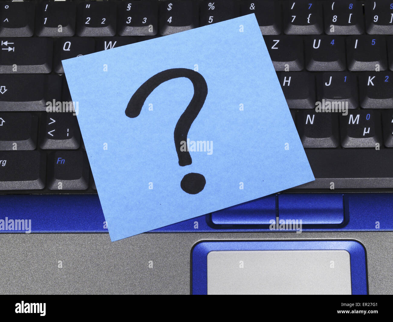 Memo note on notebook, interrogation mark Stock Photo - Alamy