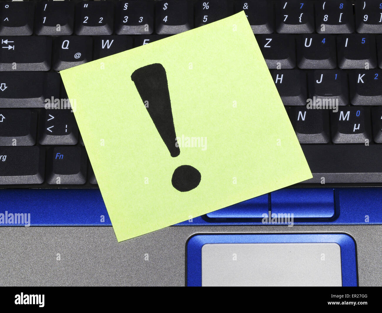 Memo note on notebook, exclamation mark Stock Photo - Alamy