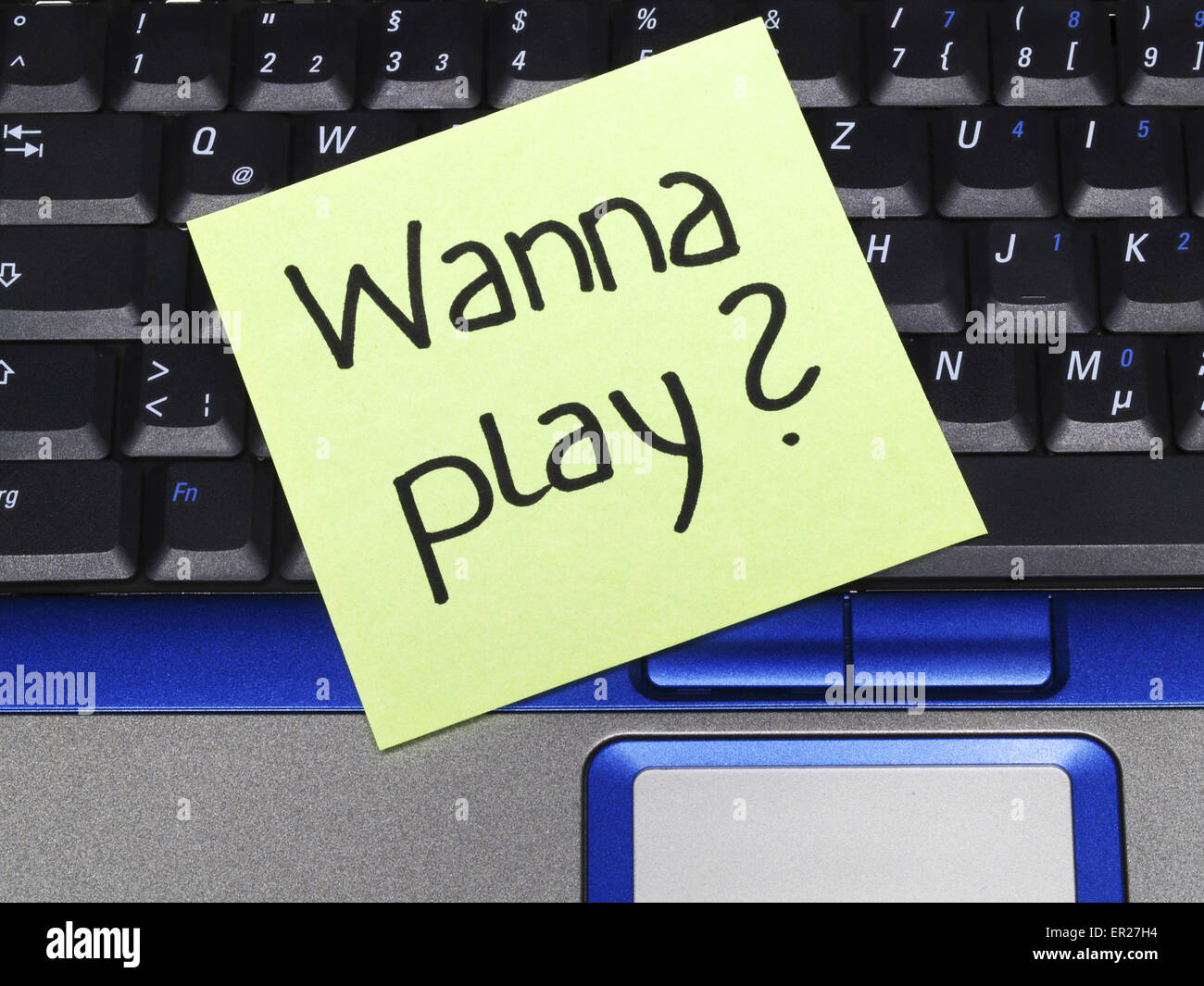 Memo note on notebook, wanna play Stock Photo - Alamy