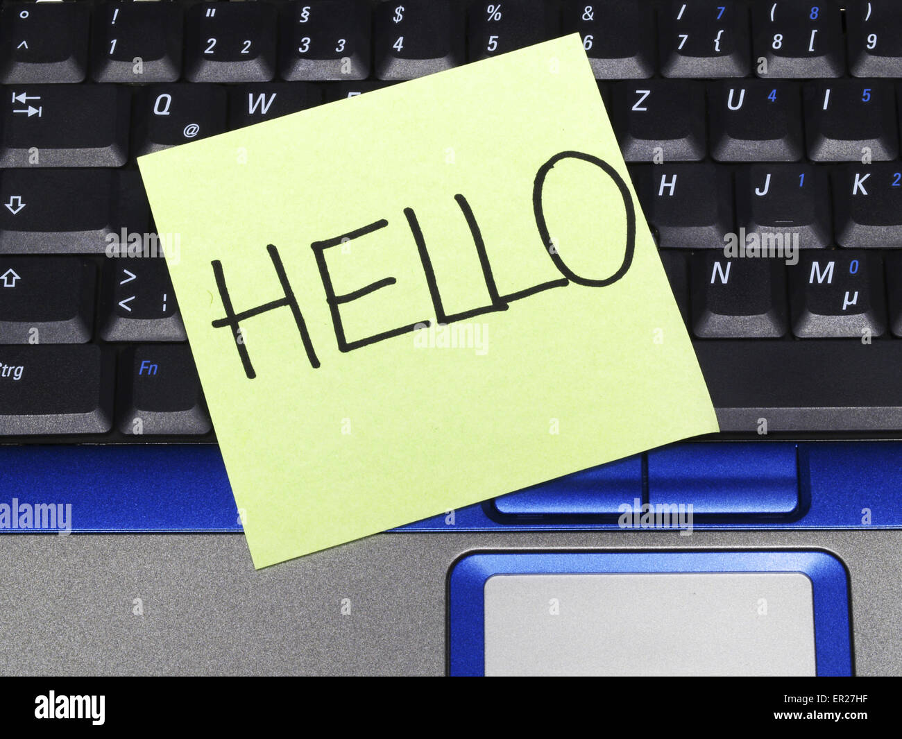 Memo note on notebook, hello Stock Photo - Alamy