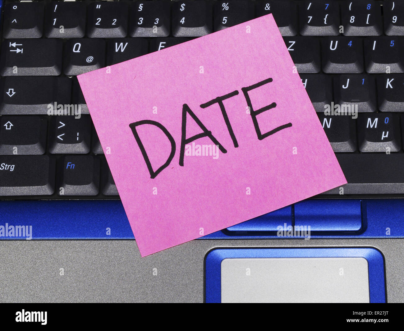 Memo note on notebook, date Stock Photo - Alamy