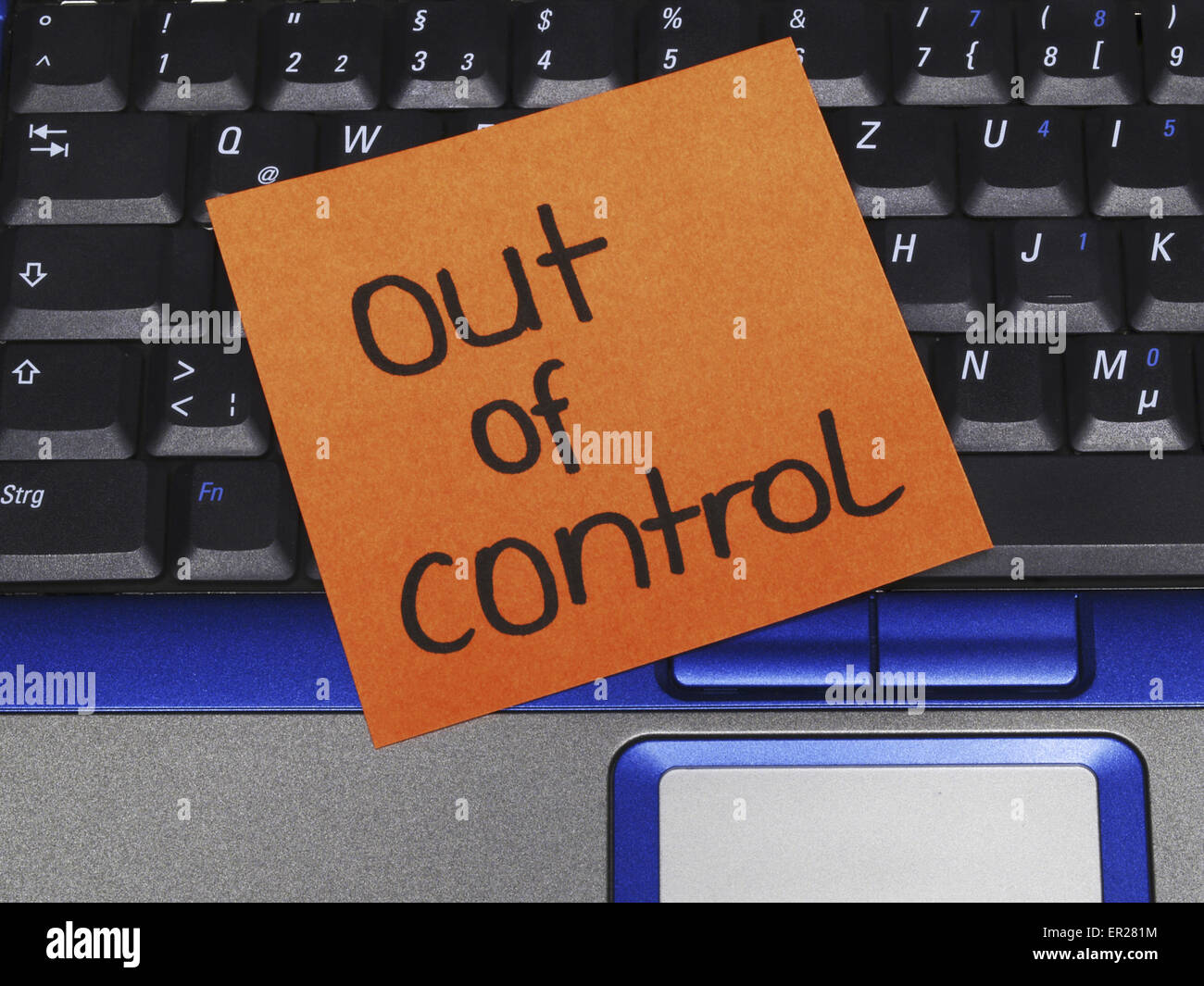 Memo note on notebook, out of control Stock Photo - Alamy