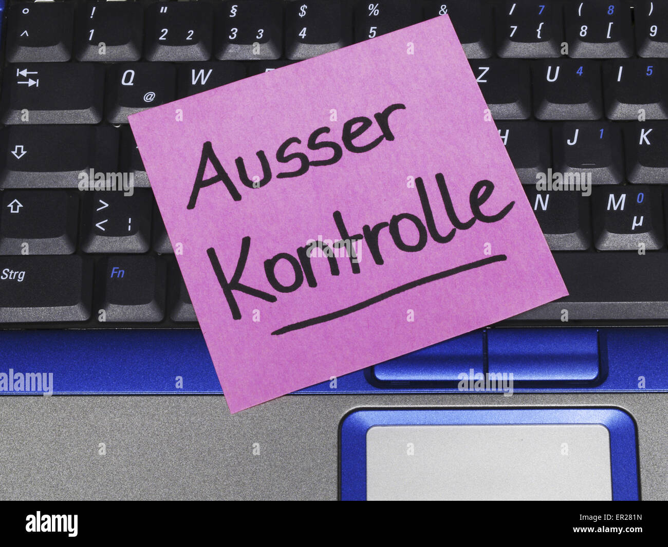 Memo note on notebook, out of control Stock Photo - Alamy