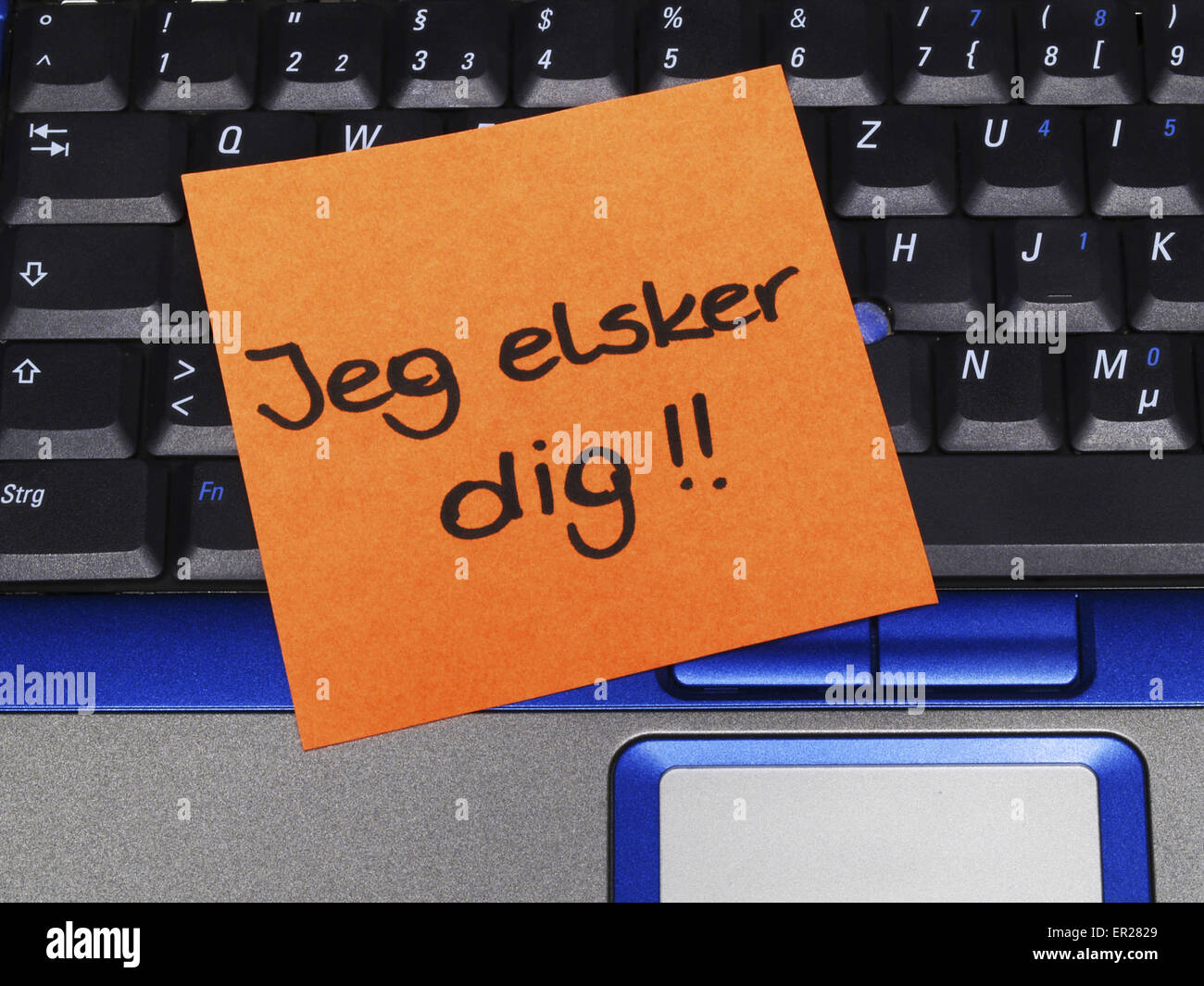 Memo note on notebook Stock Photo - Alamy