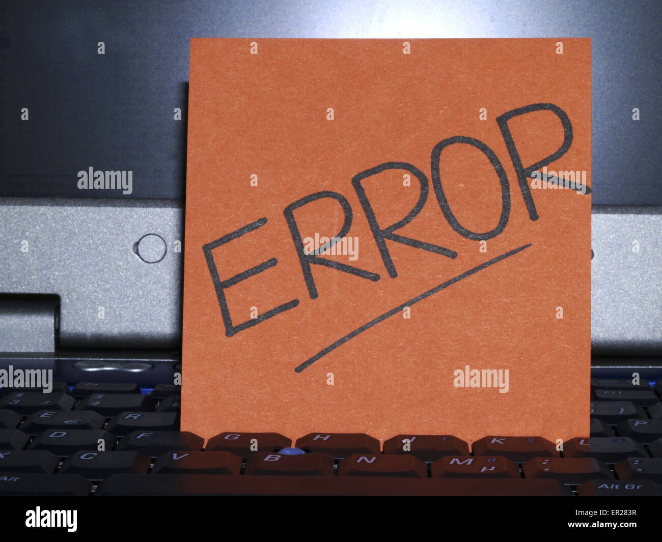 Memo note on notebook, error Stock Photo - Alamy