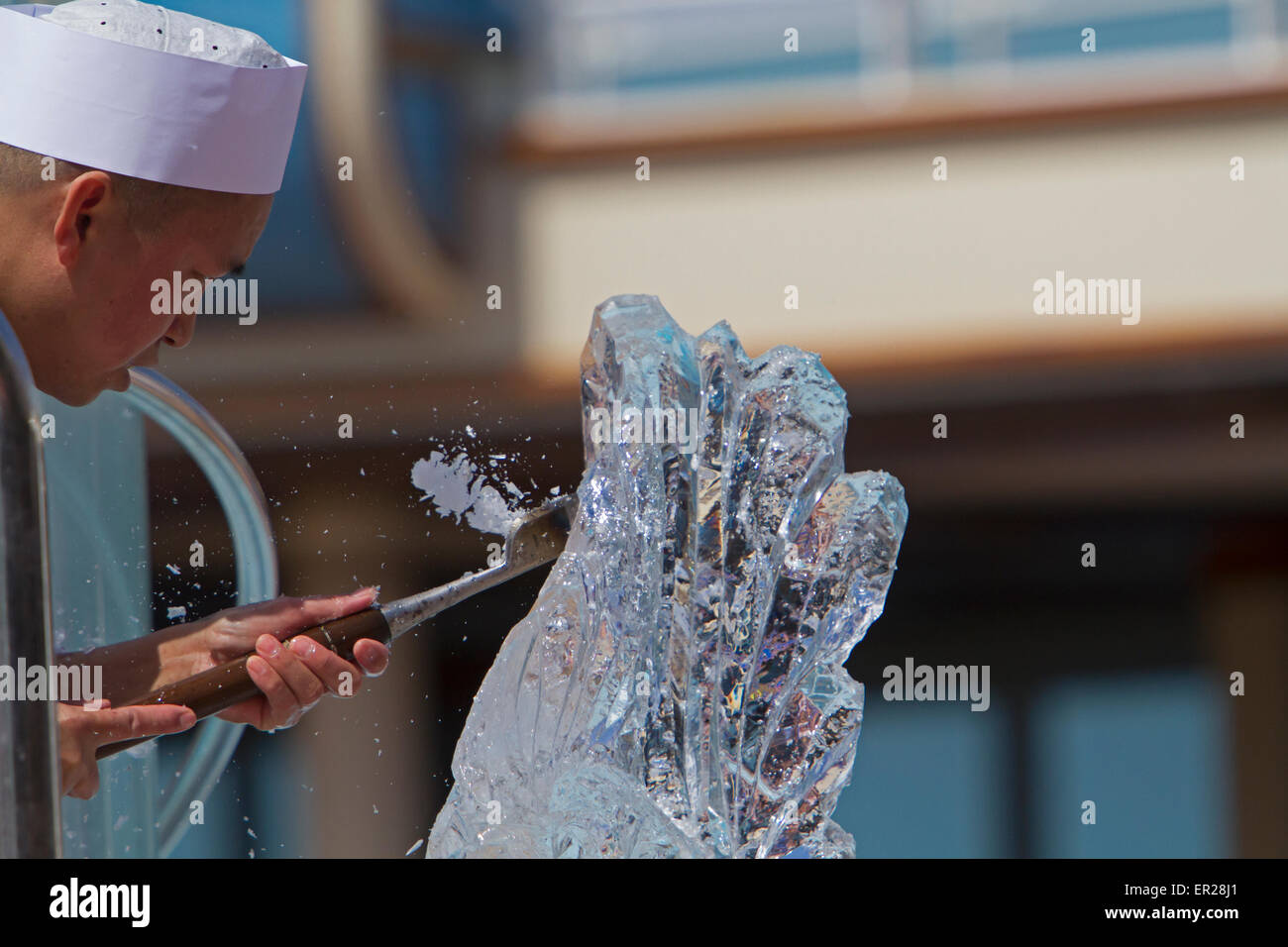 A chef demonstrates Ice carving on board the Azura Stock Photo - Alamy