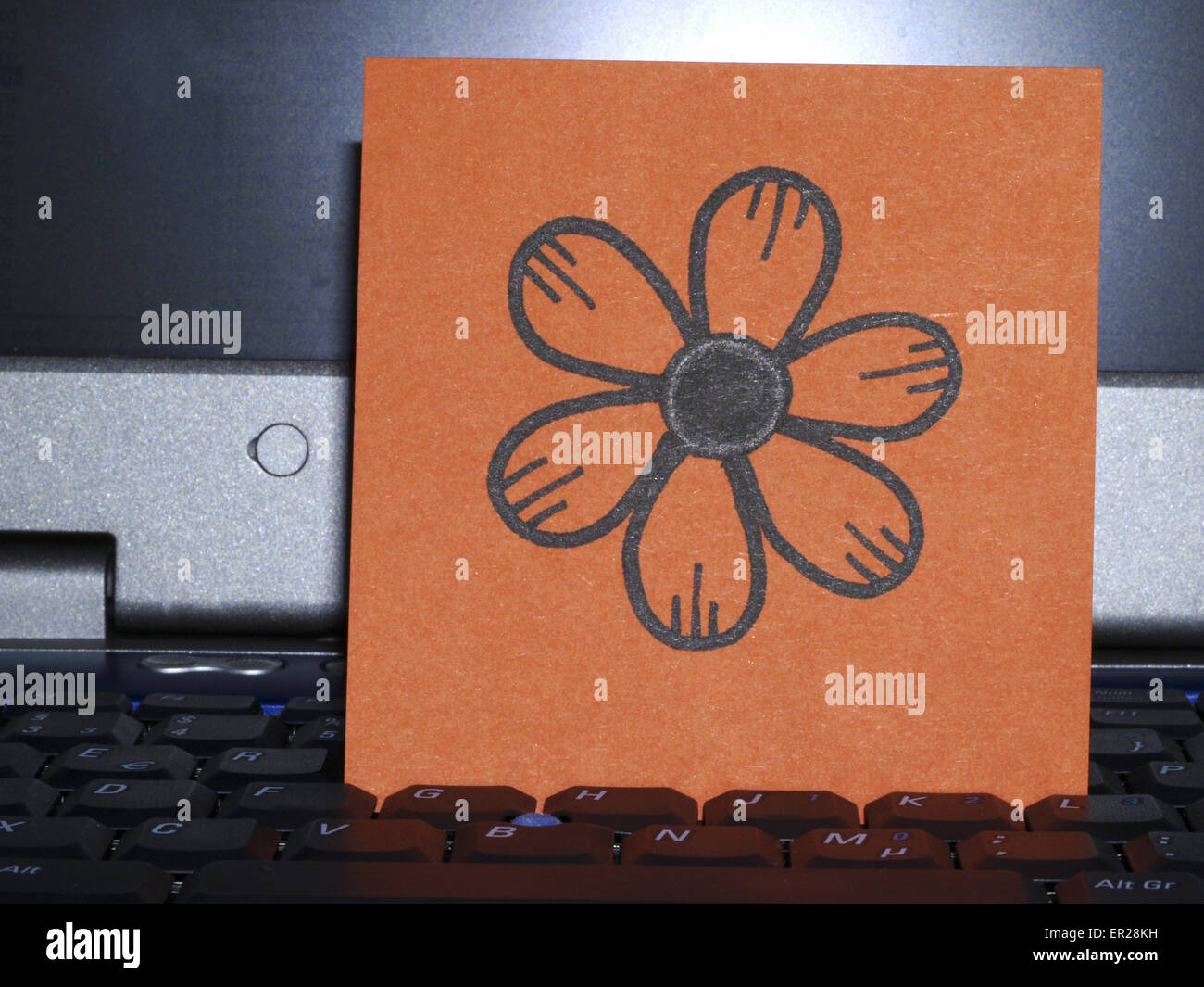 Memo note on notebook, drawing flower Stock Photo - Alamy