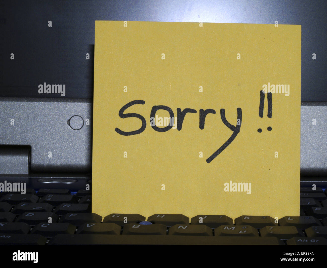 Memo note on notebook, sorry Stock Photo - Alamy