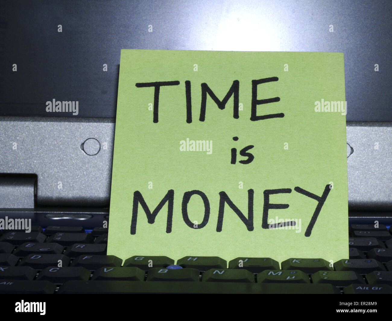 Memo note on notebook, time ist money Stock Photo - Alamy
