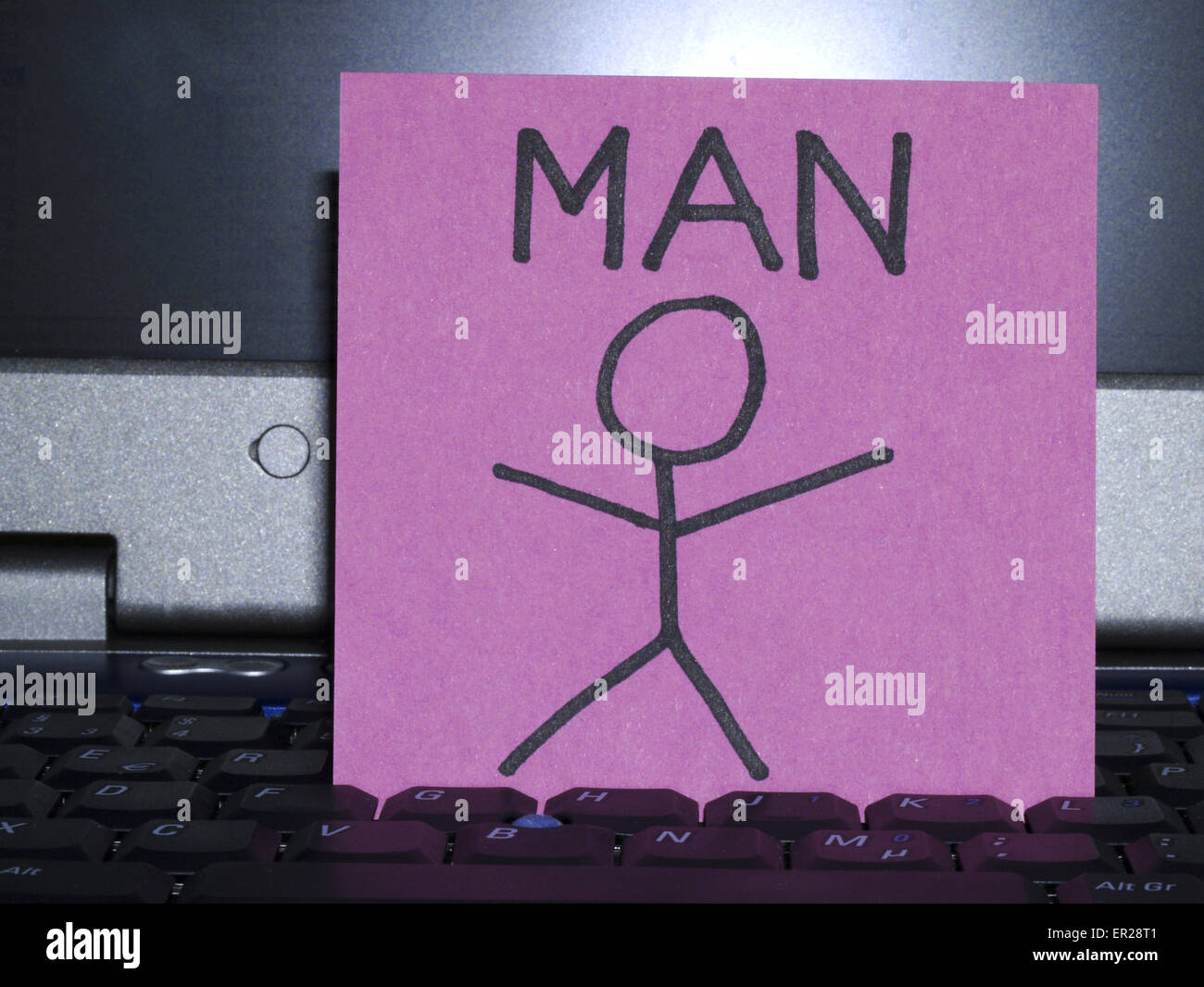 Memo note on notebook, drawing man Stock Photo - Alamy