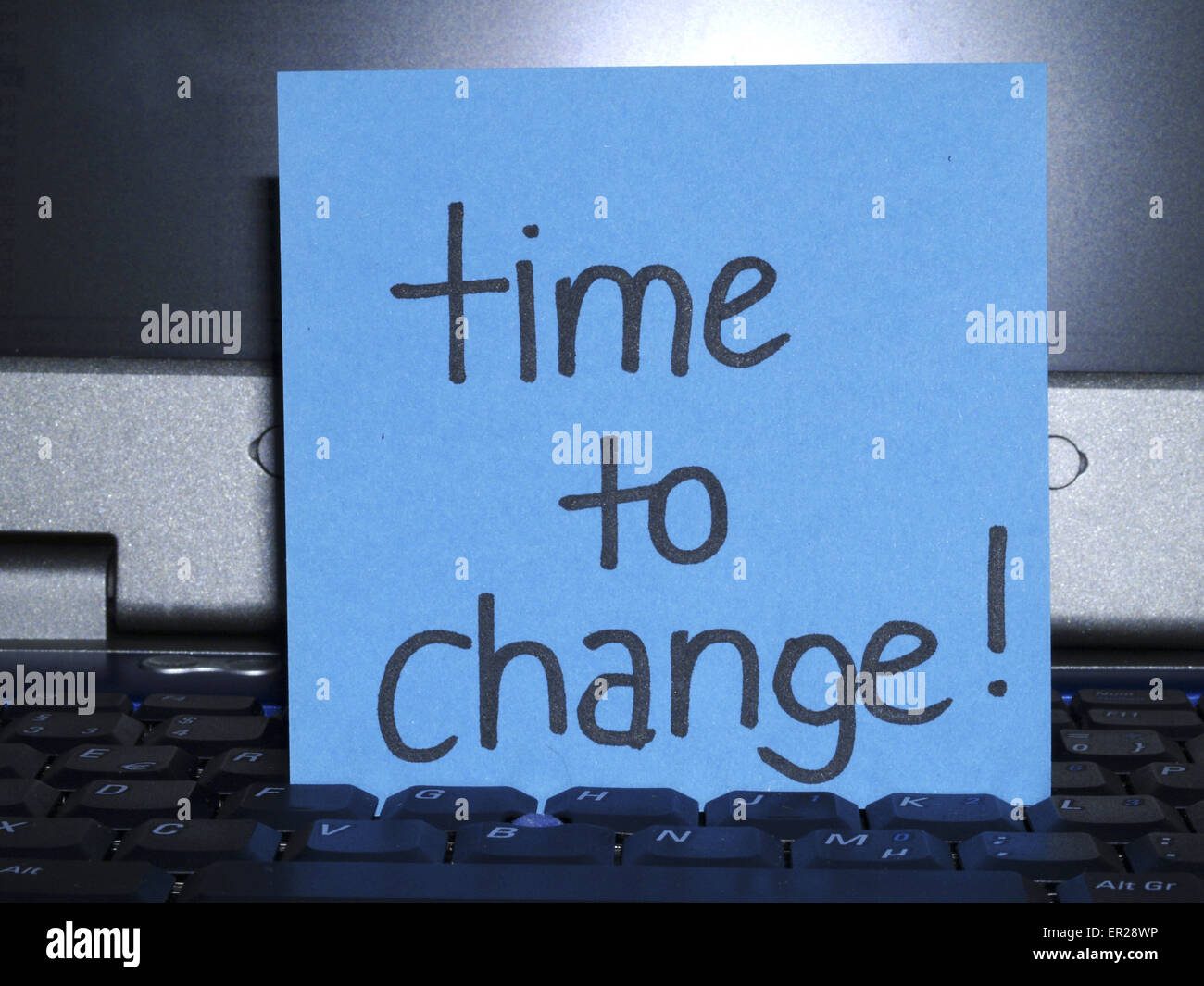 Memo note on notebook, Time to change Stock Photo - Alamy