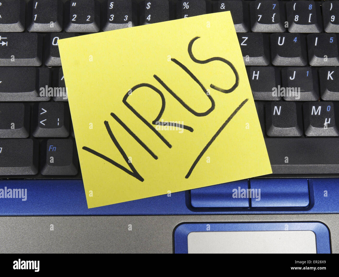 Memo note on notebook, virus Stock Photo - Alamy
