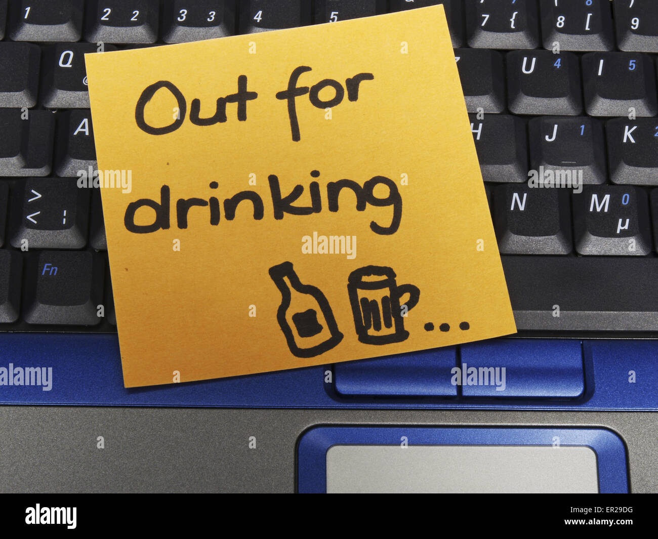 Memo note on notebook, out for drinking Stock Photo - Alamy