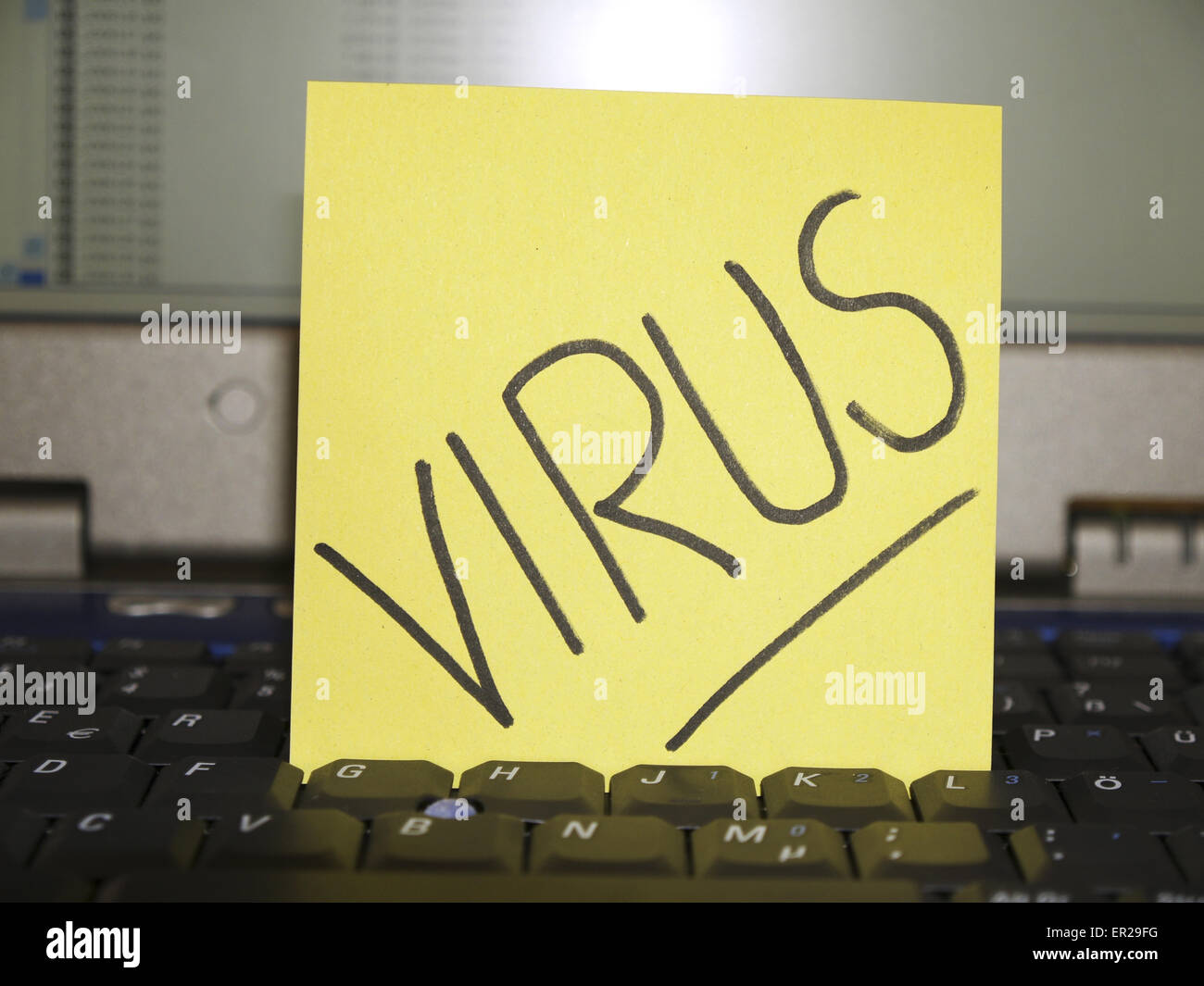 Memo note on notebook, virus Stock Photo - Alamy