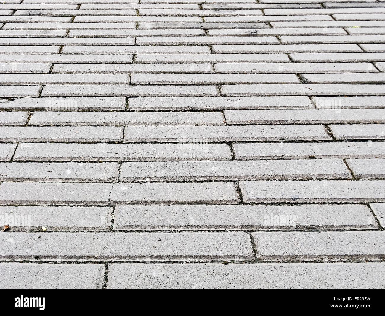 Rough, tiled floor outside a commercial building Stock Photo - Alamy
