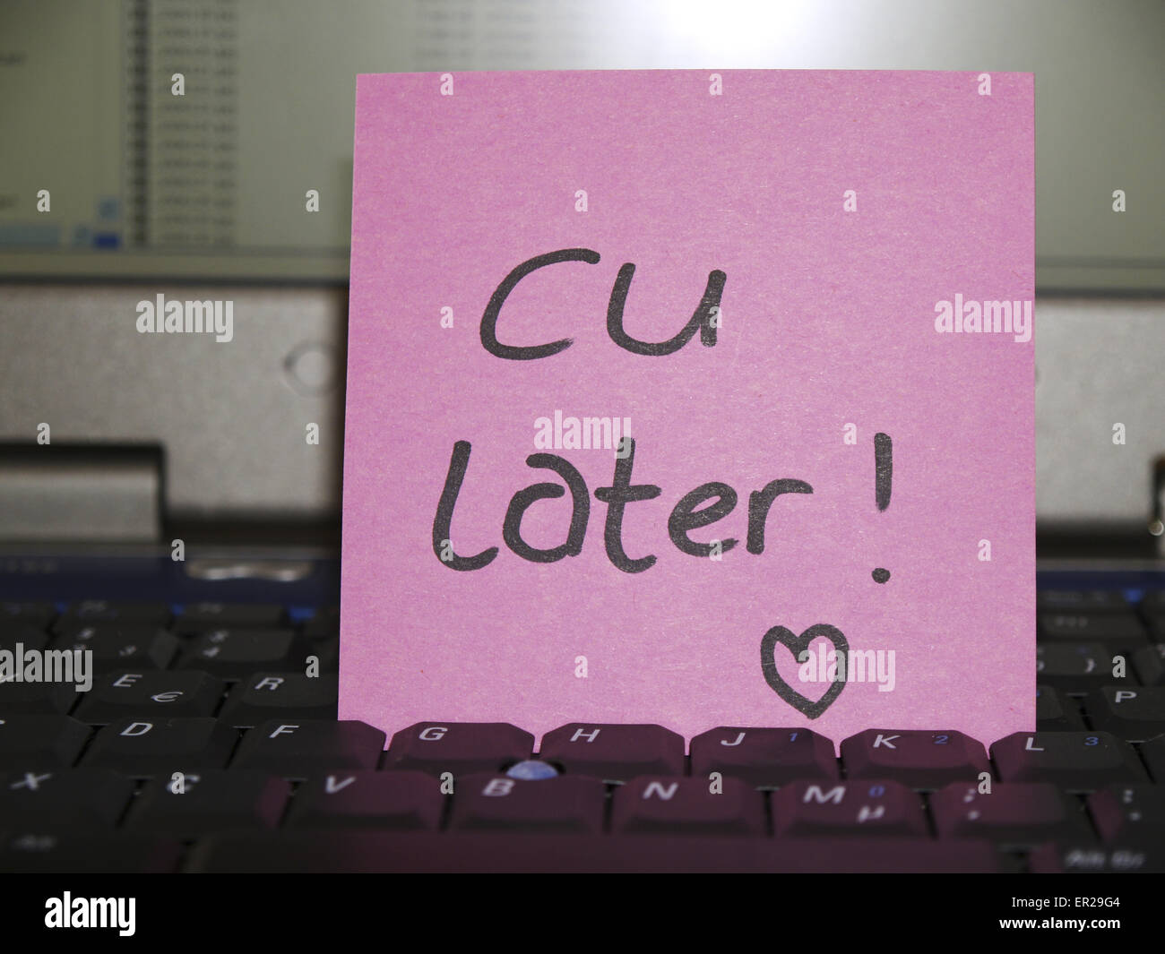 Memo note on notebook, cu later Stock Photo - Alamy