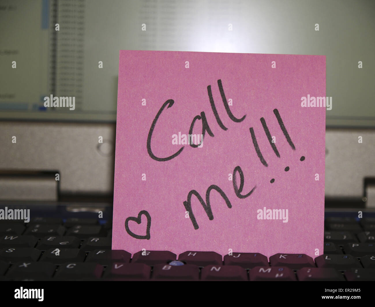 Memo note on notebook, call me Stock Photo - Alamy