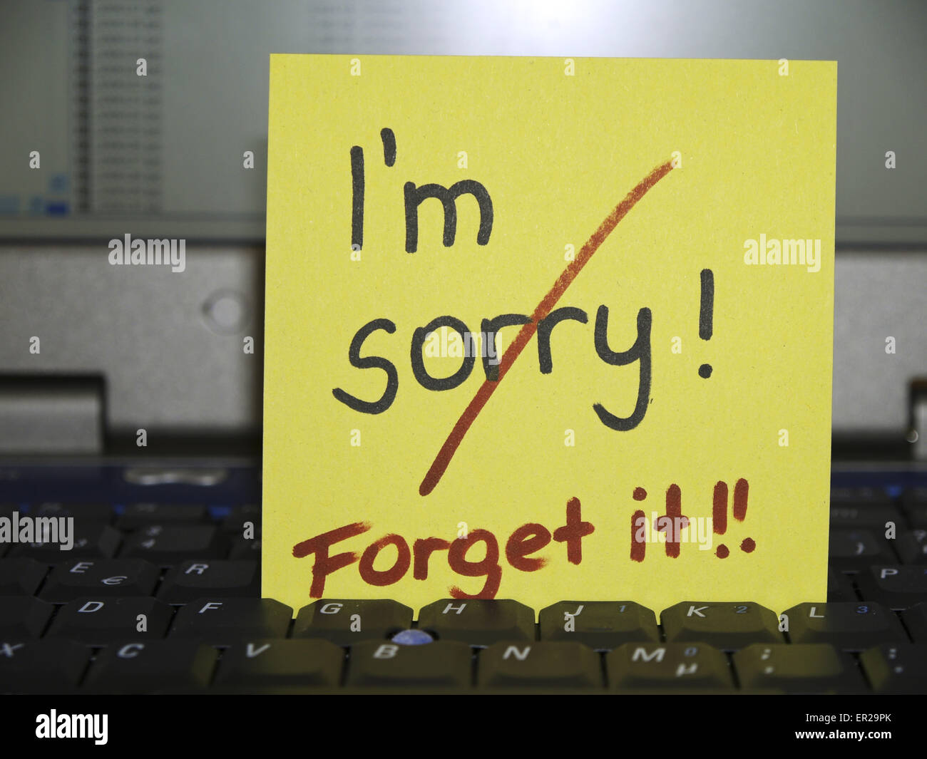 Memo note on notebook, I´m sorry, forget it Stock Photo - Alamy