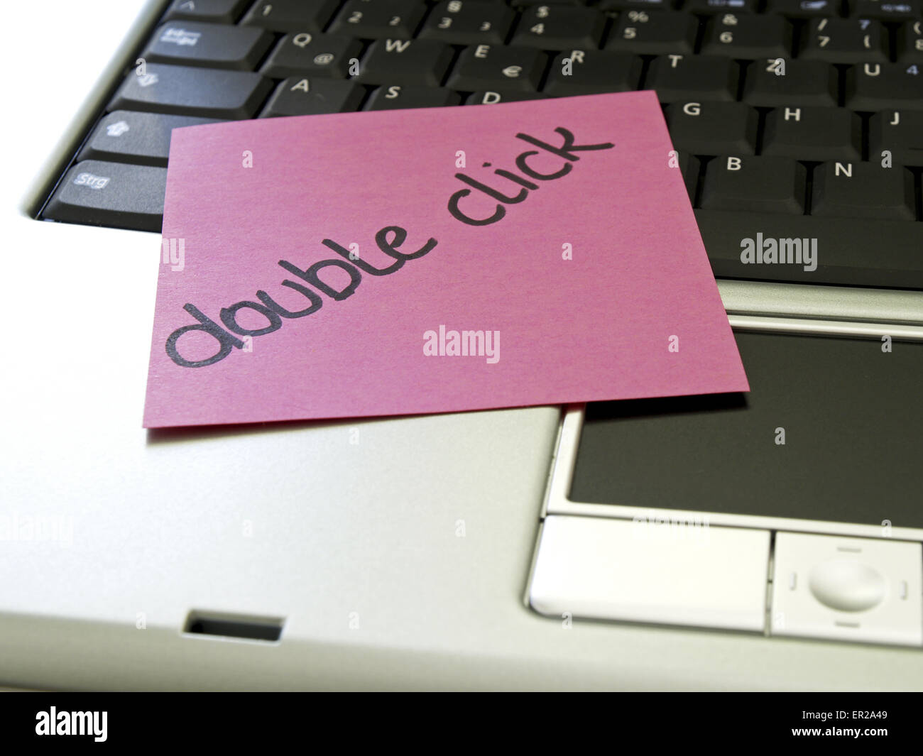 Memo note on notebook, double click Stock Photo - Alamy