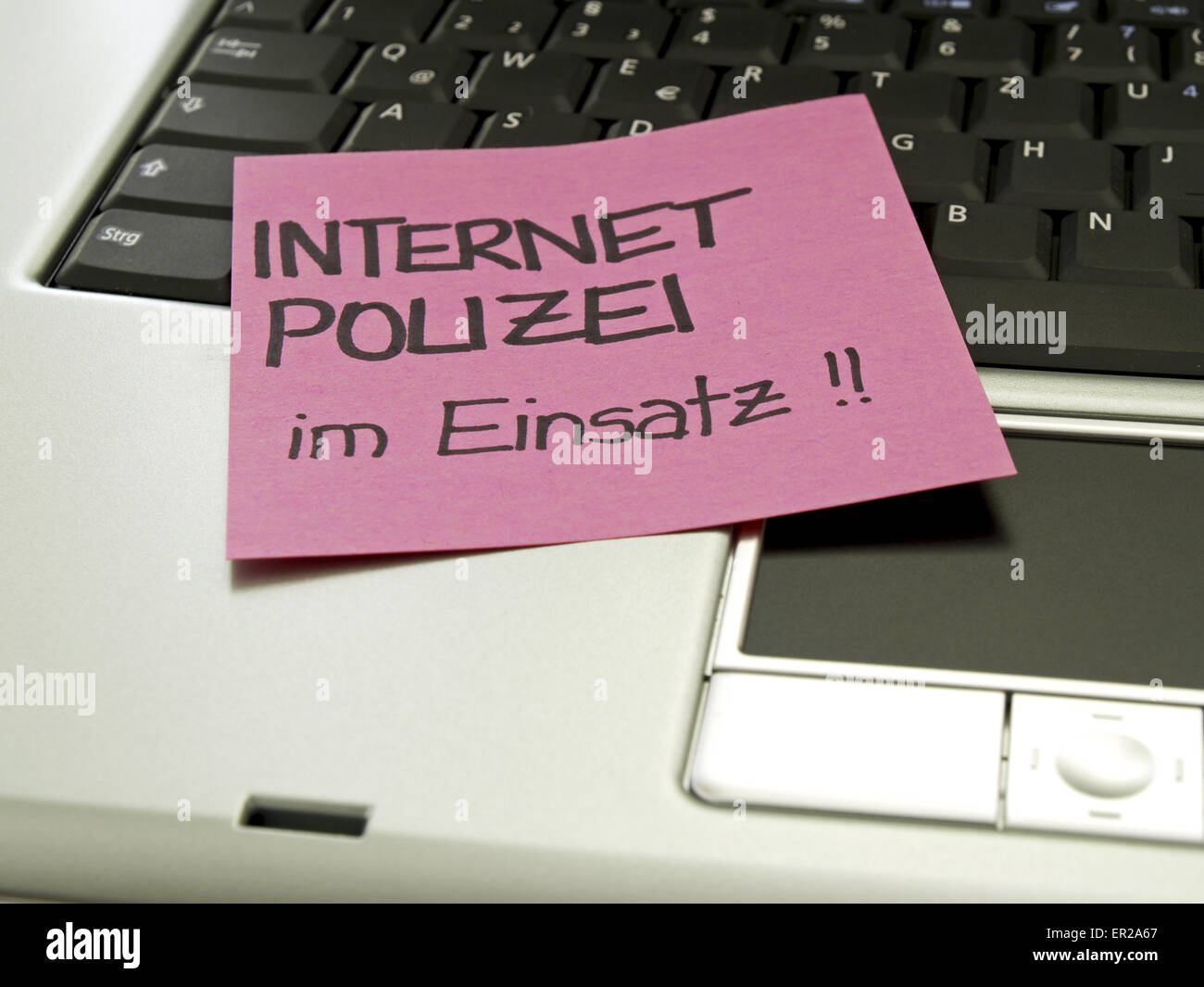 Memo note on notebook, internet police in service Stock Photo - Alamy