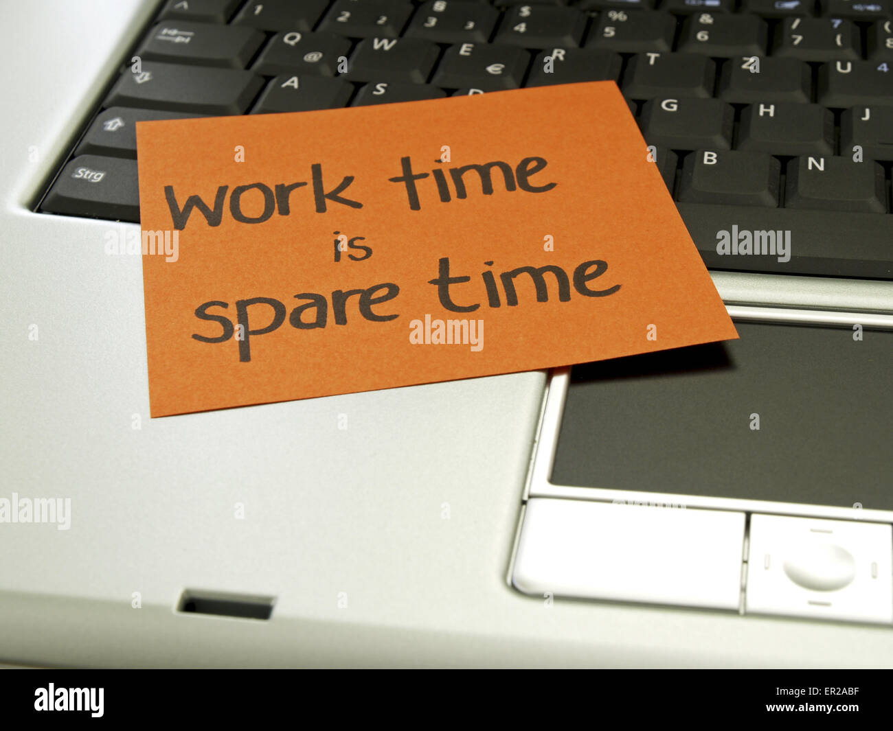 Memo note on notebook, work time is spare time Stock Photo - Alamy