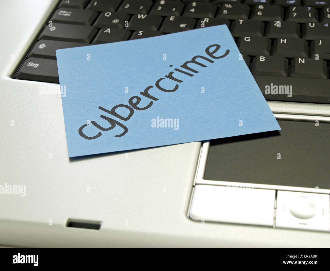 Memo note on notebook, cybercrime Stock Photo - Alamy