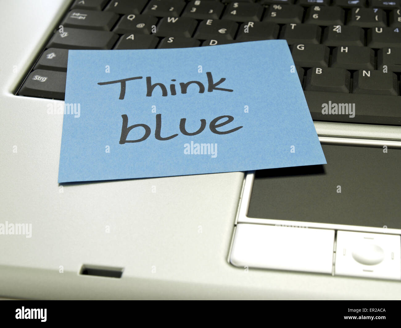 Memo note on notebook, think blue Stock Photo - Alamy
