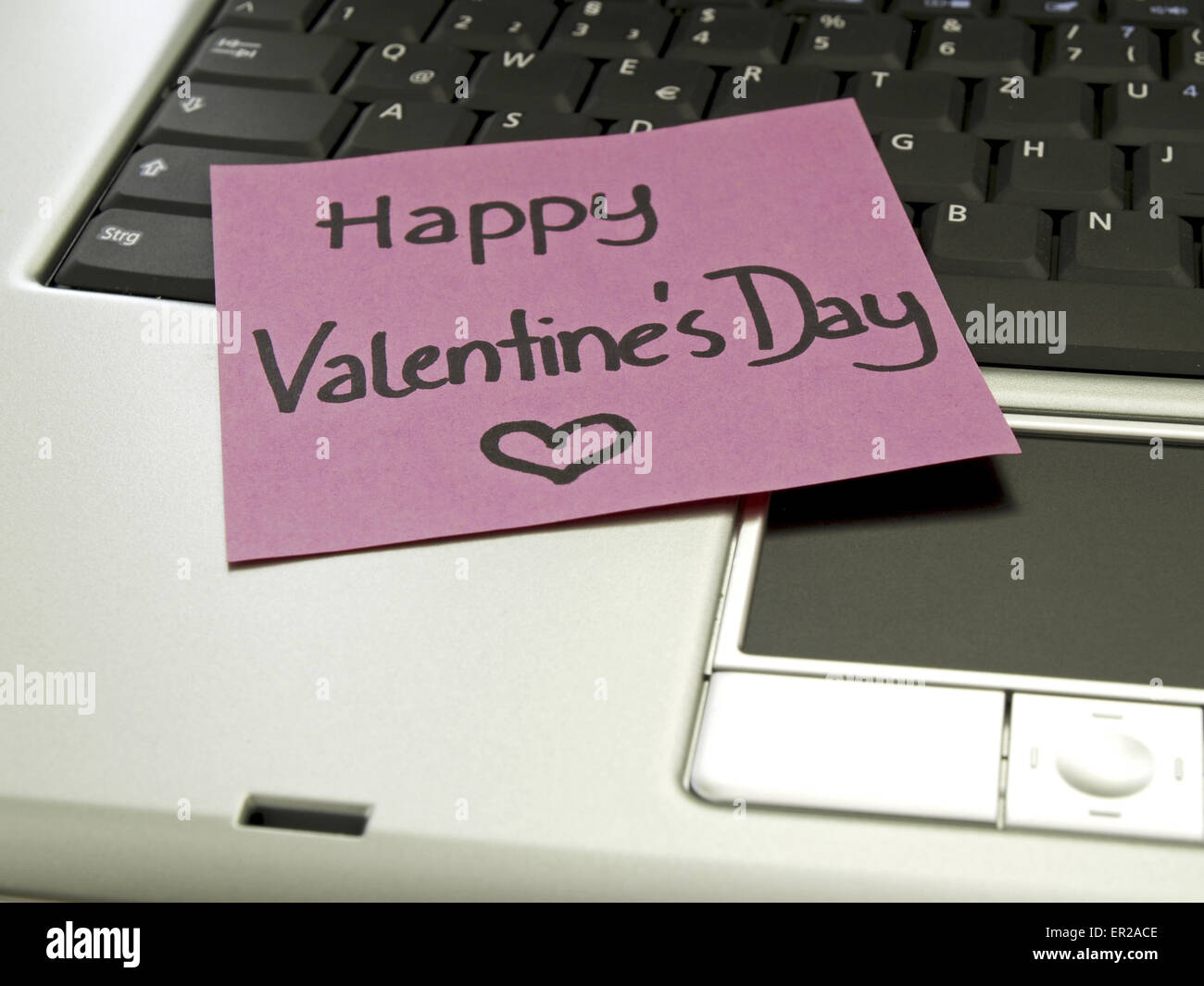 Memo note on notebook, happy Valentine´s Day Stock Photo - Alamy