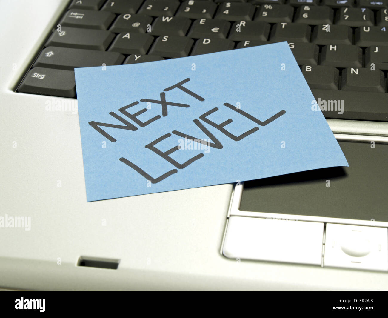 Memo note on notebook, next level Stock Photo - Alamy
