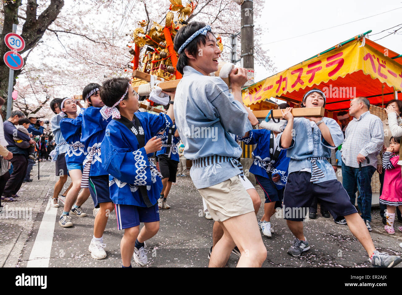 The yearly Genji parade in Tada, Japan. Team of men lifting and ...