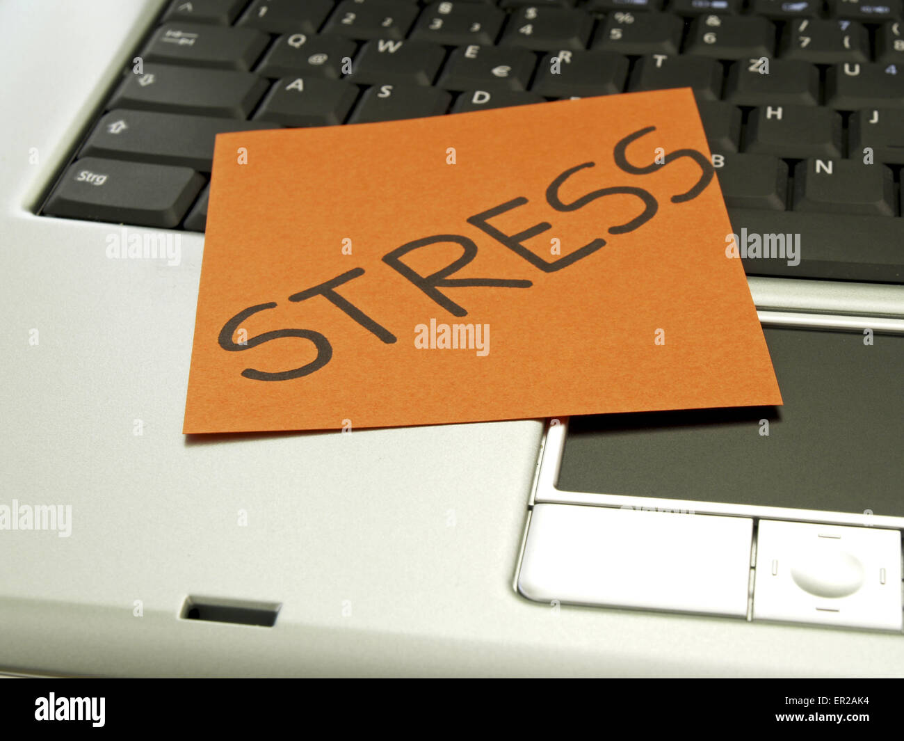 Memo note on notebook, stress Stock Photo - Alamy
