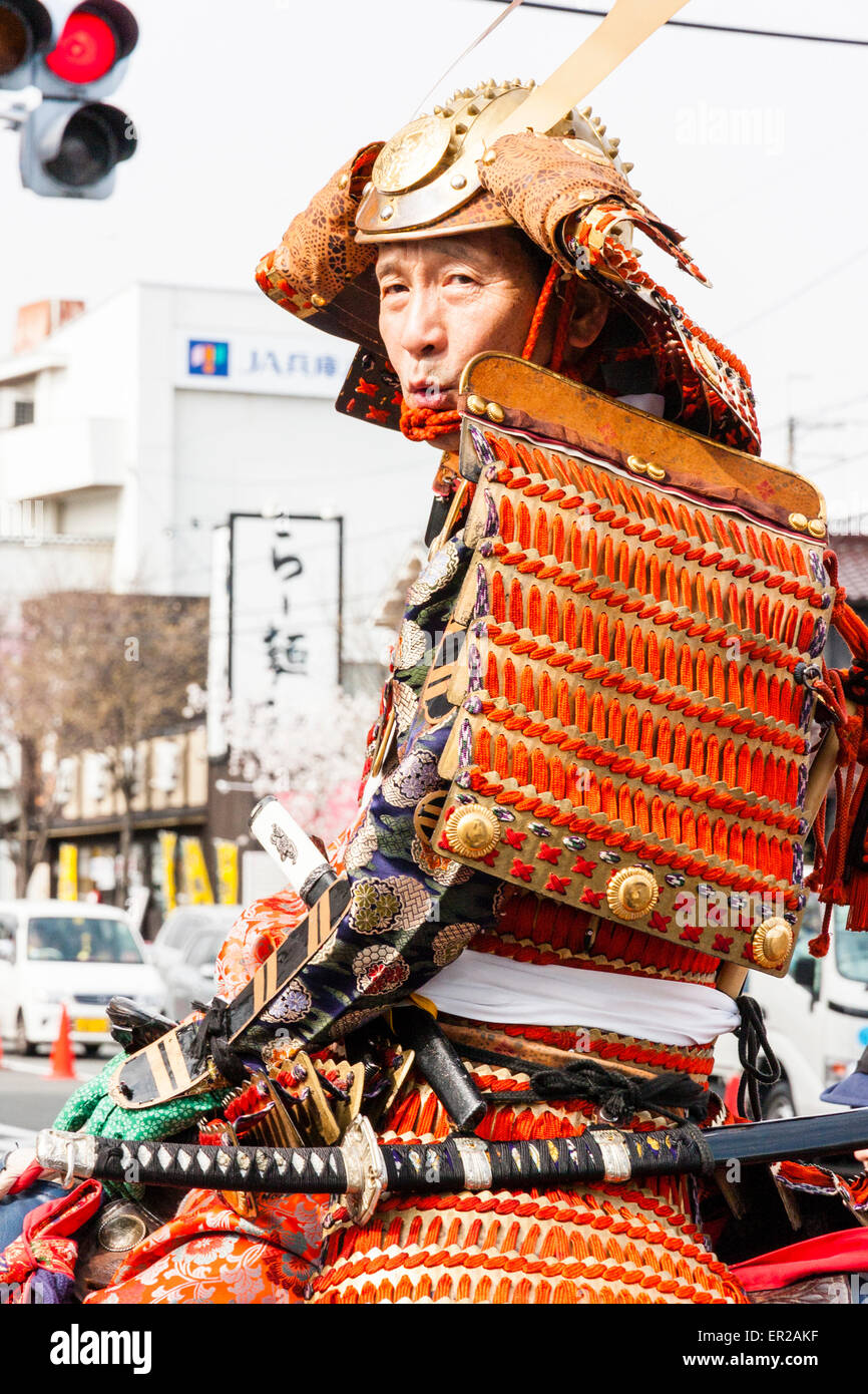 Japanese man dressed in full samurai armour and Kabuto helmet, on ...