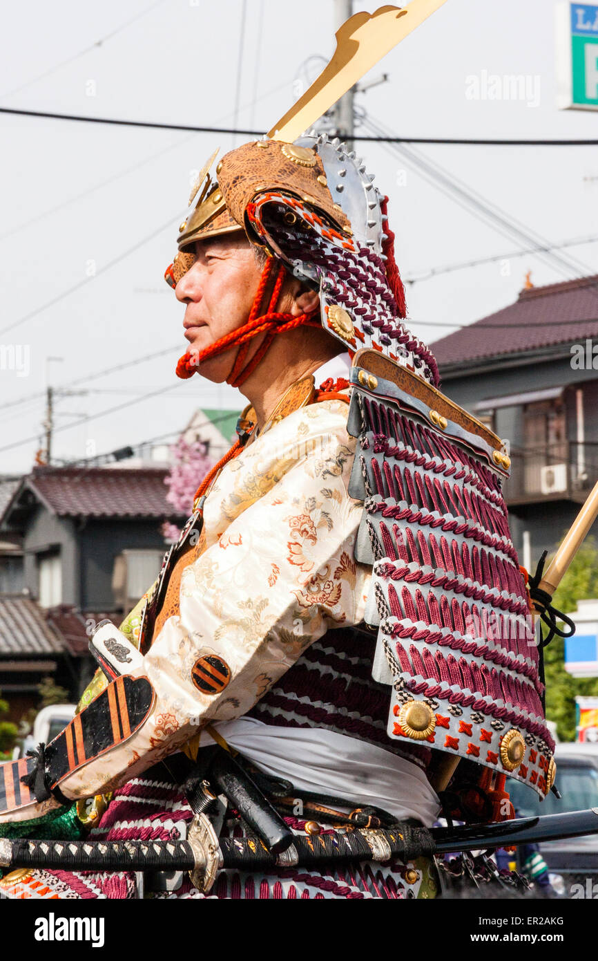 Japanese man dressed in full samurai armour and Kabuto helmet, on ...