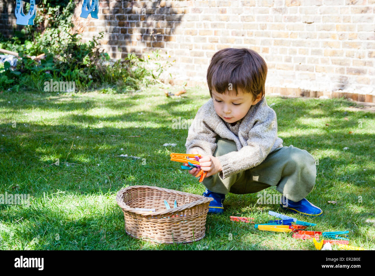 Child tidying up hi-res stock photography and images - Alamy