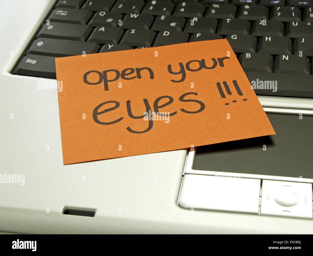 Memo note on notebook, open your eyes Stock Photo - Alamy