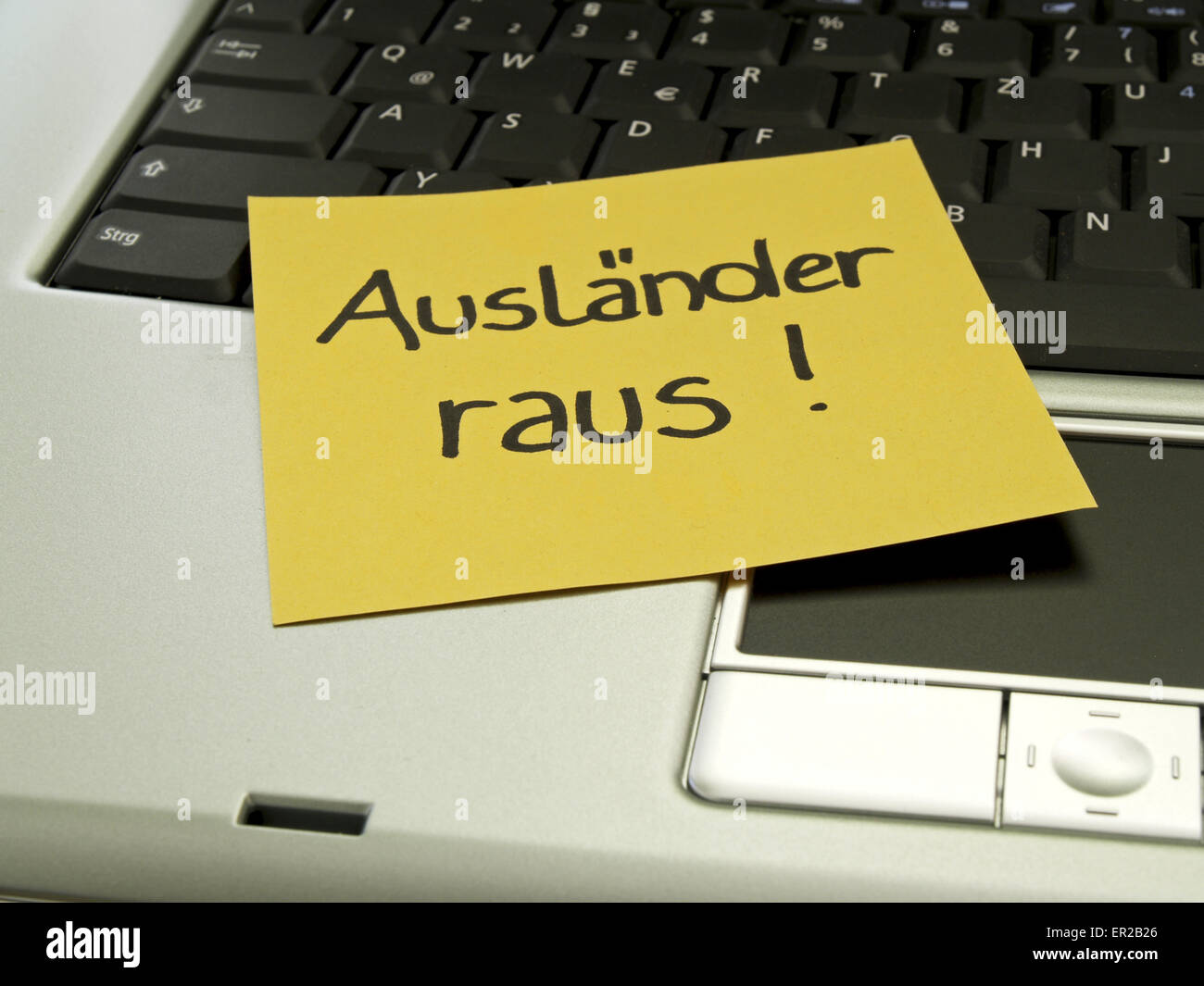 Memo note on notebook, foreigners out Stock Photo - Alamy