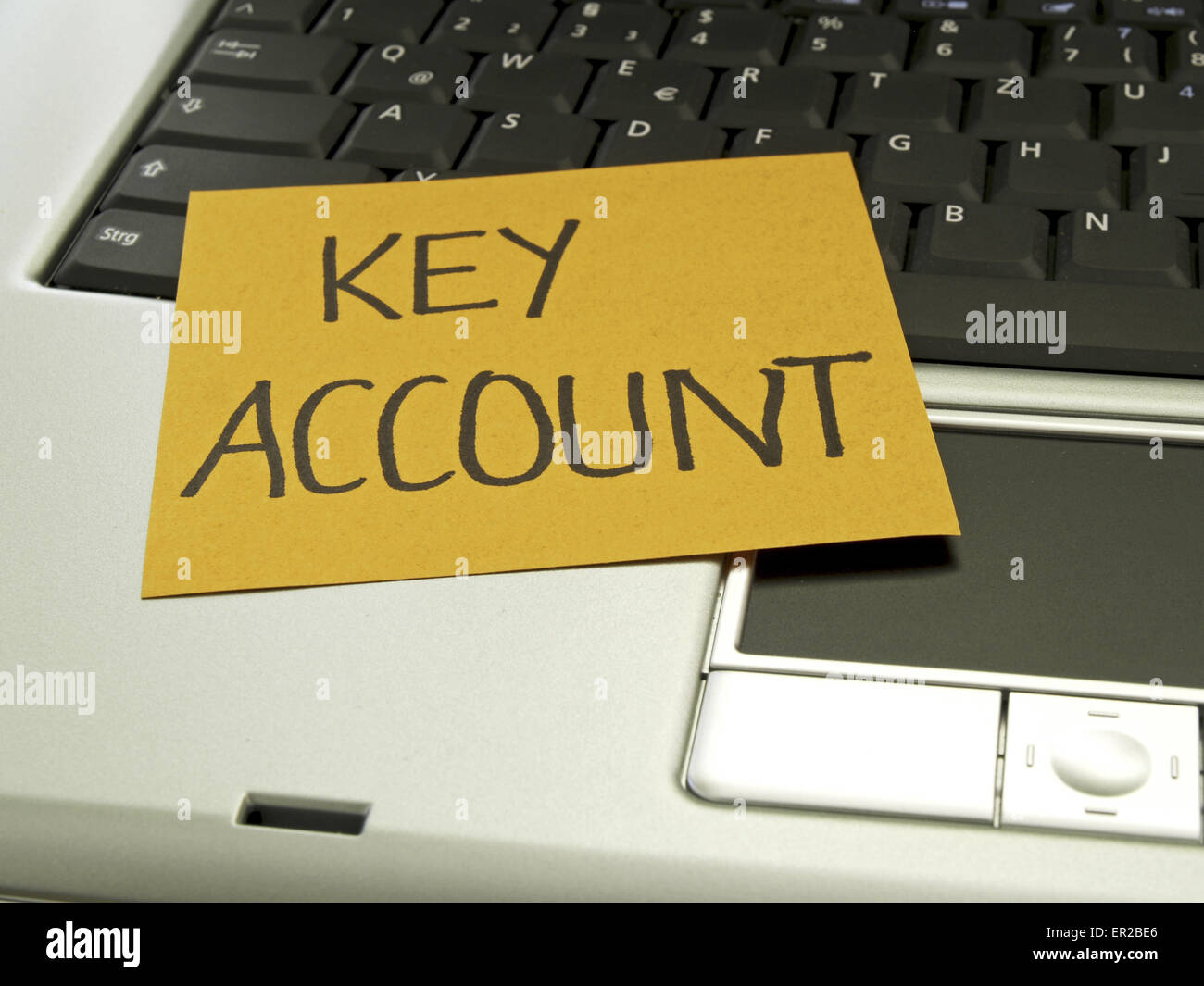Memo note on notebook, Key account Stock Photo - Alamy