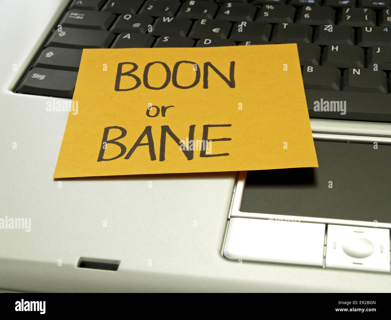 Memo note on notebook, boon or bane Stock Photo - Alamy