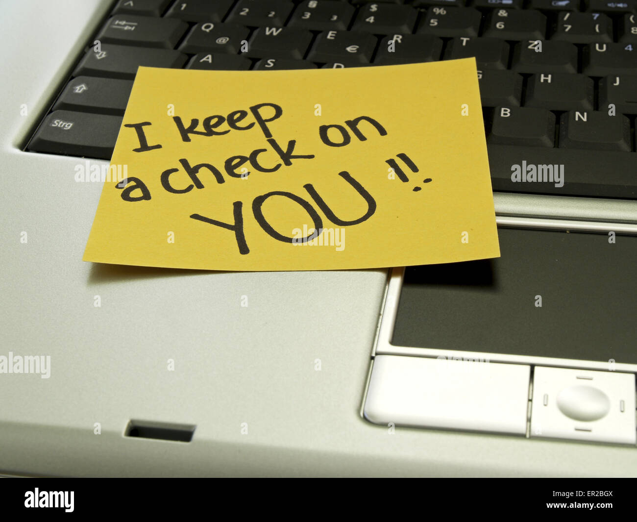 Memo note on notebook, I keep a check on you Stock Photo - Alamy