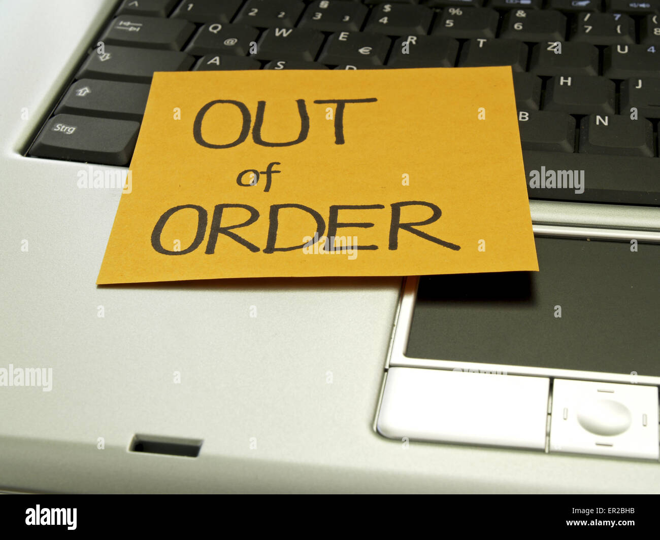 Memo note on notebook, out of order Stock Photo - Alamy