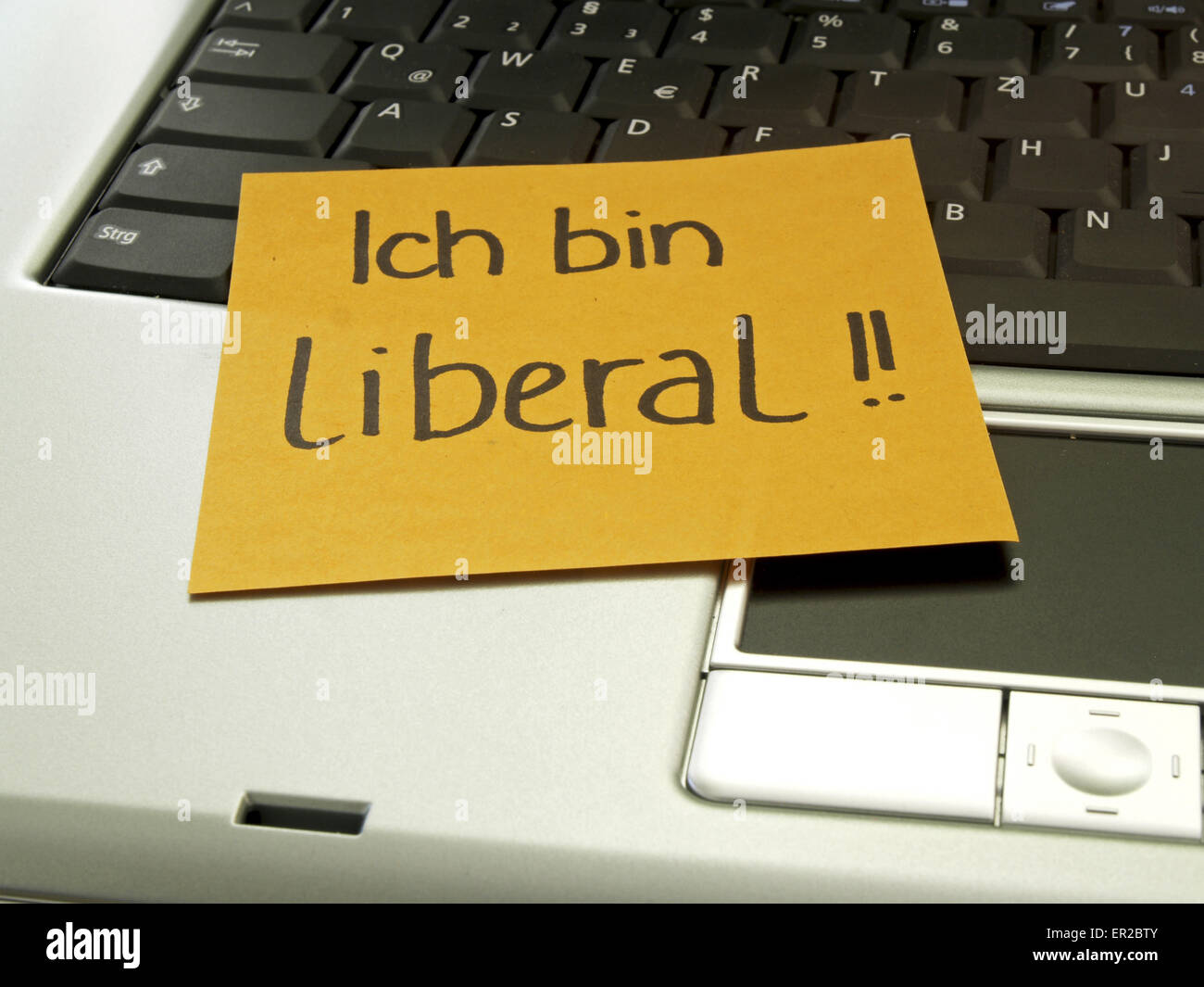 Memo note on notebook, I am liberal Stock Photo - Alamy