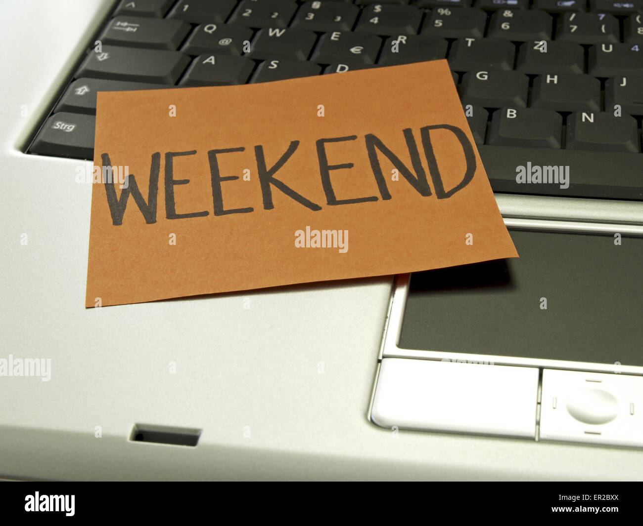 Memo note on notebook, weekend Stock Photo - Alamy